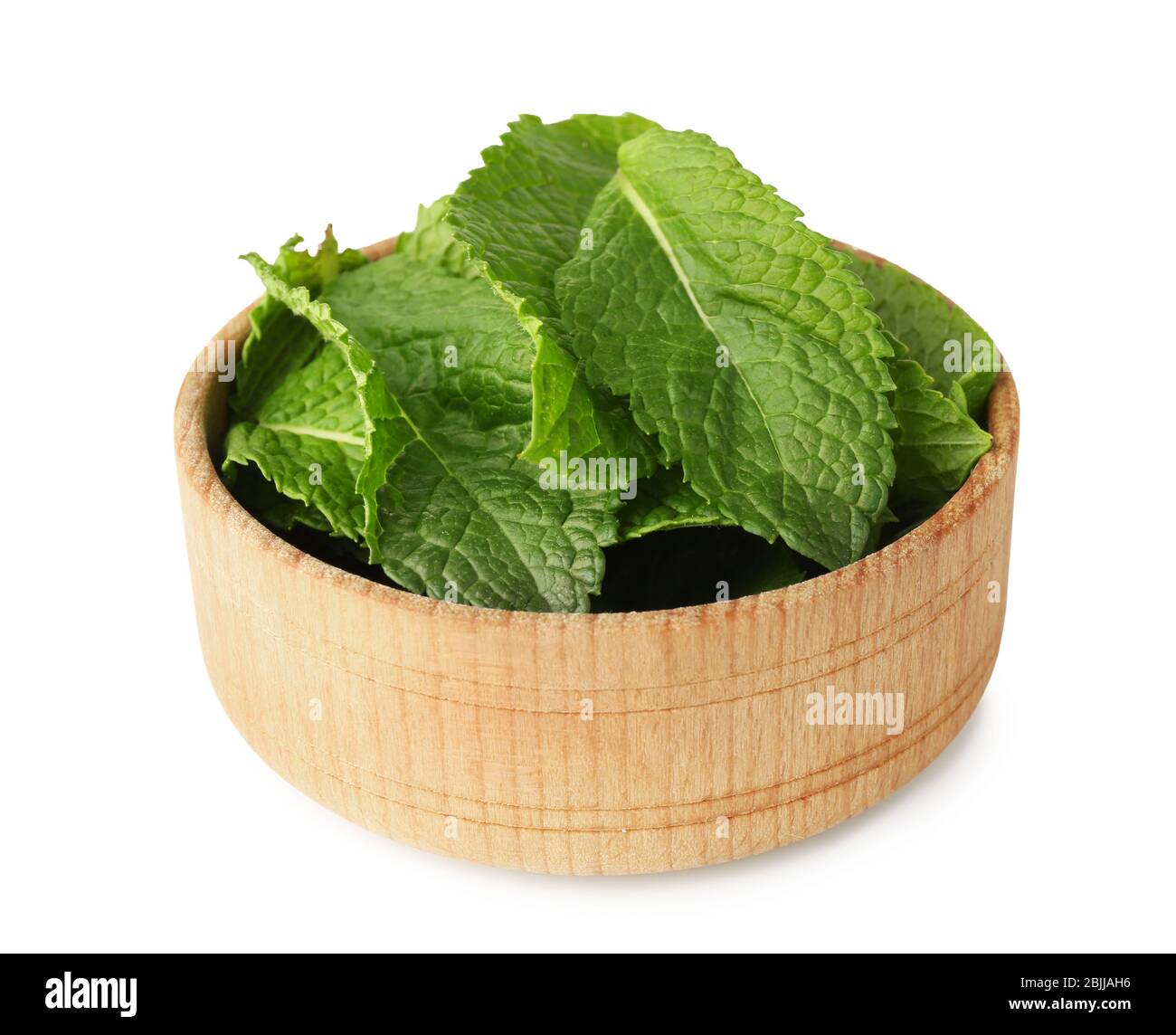 Wooden bowl with fresh mint leaves on white background Stock Photo - Alamy