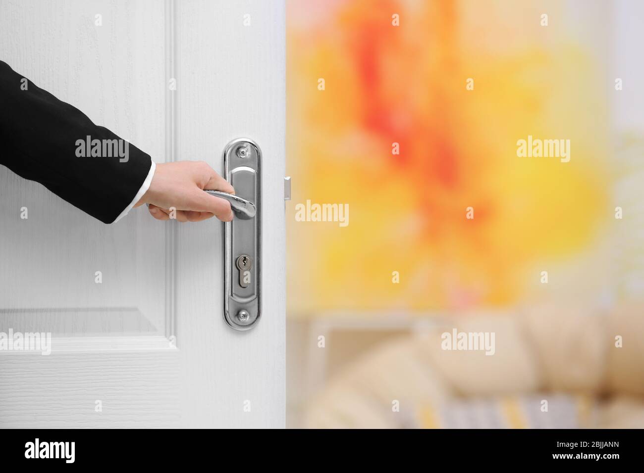 Person opening door of hotel room Stock Photo - Alamy