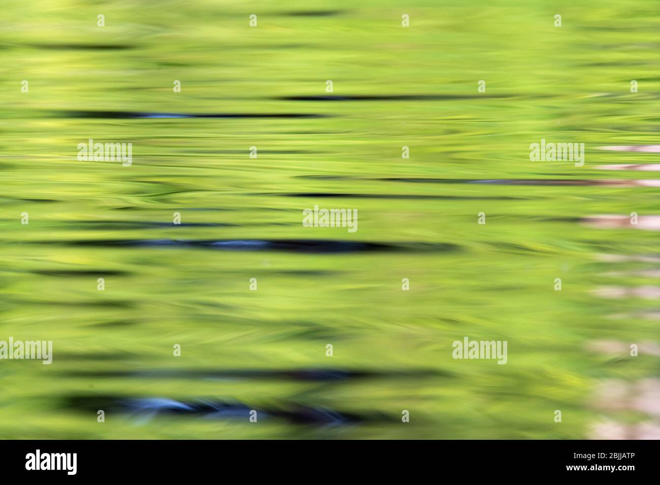 Abstract of green river water on one of the Amazon tributaries in Peru ...