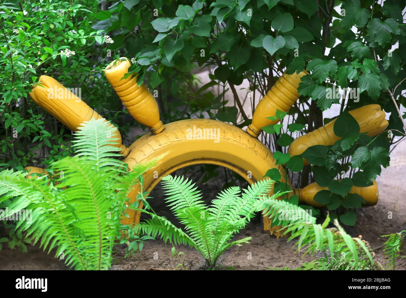 Sun made from old garbage, outdoors Stock Photo - Alamy