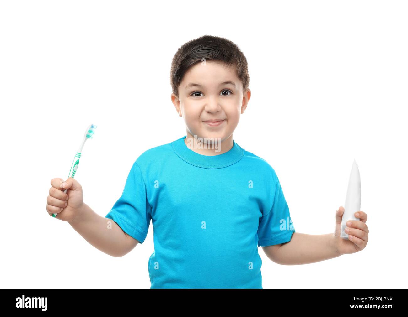 Cute boy with toothbrush and paste on white background. Teeth cleaning ...