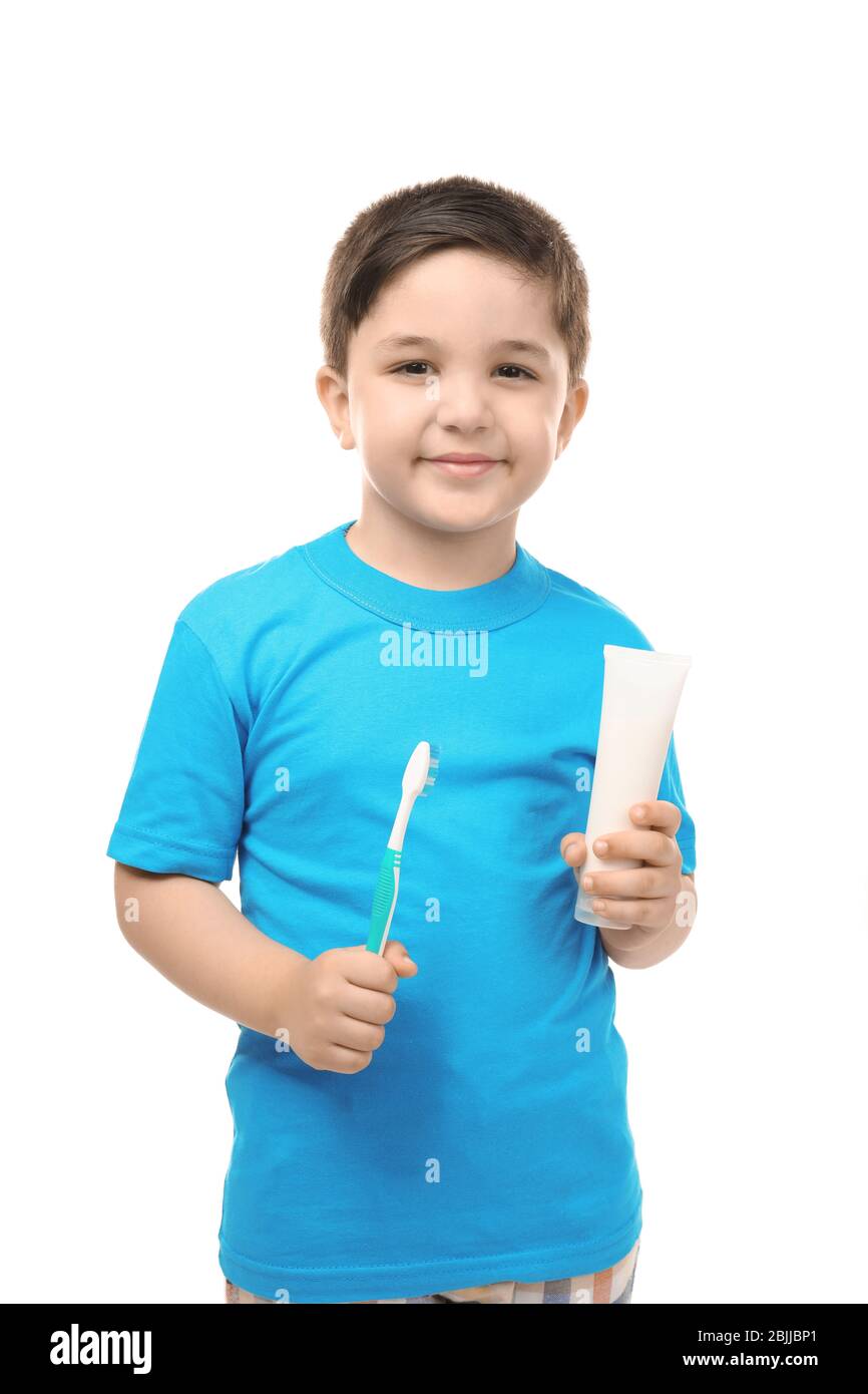 Cute boy with toothbrush and paste on white background. Teeth cleaning ...