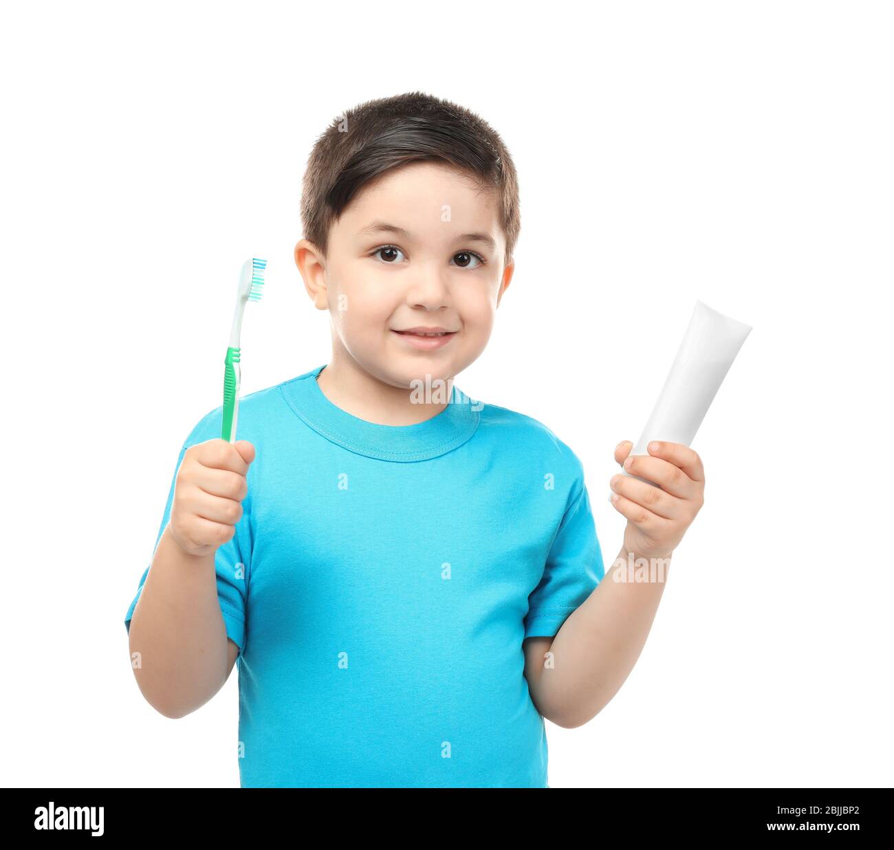 Cute boy with toothbrush and paste on white background. Teeth cleaning ...