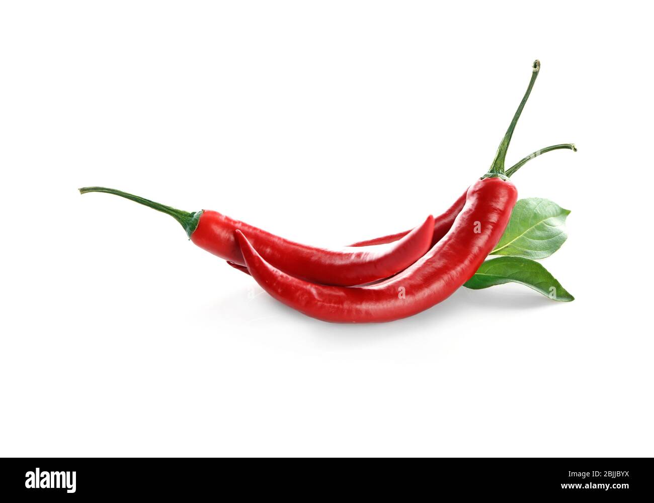Chili peppers on white background Stock Photo - Alamy