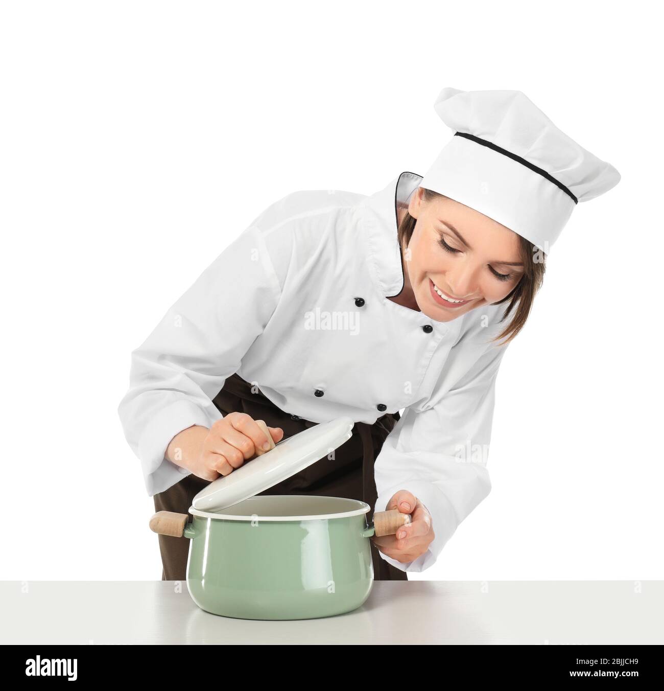 Female chef with saucepan on white background Stock Photo - Alamy