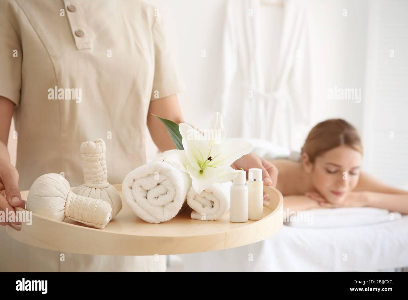 Beautiful young masseuse applying massage hi-res stock photography and images - Alamy