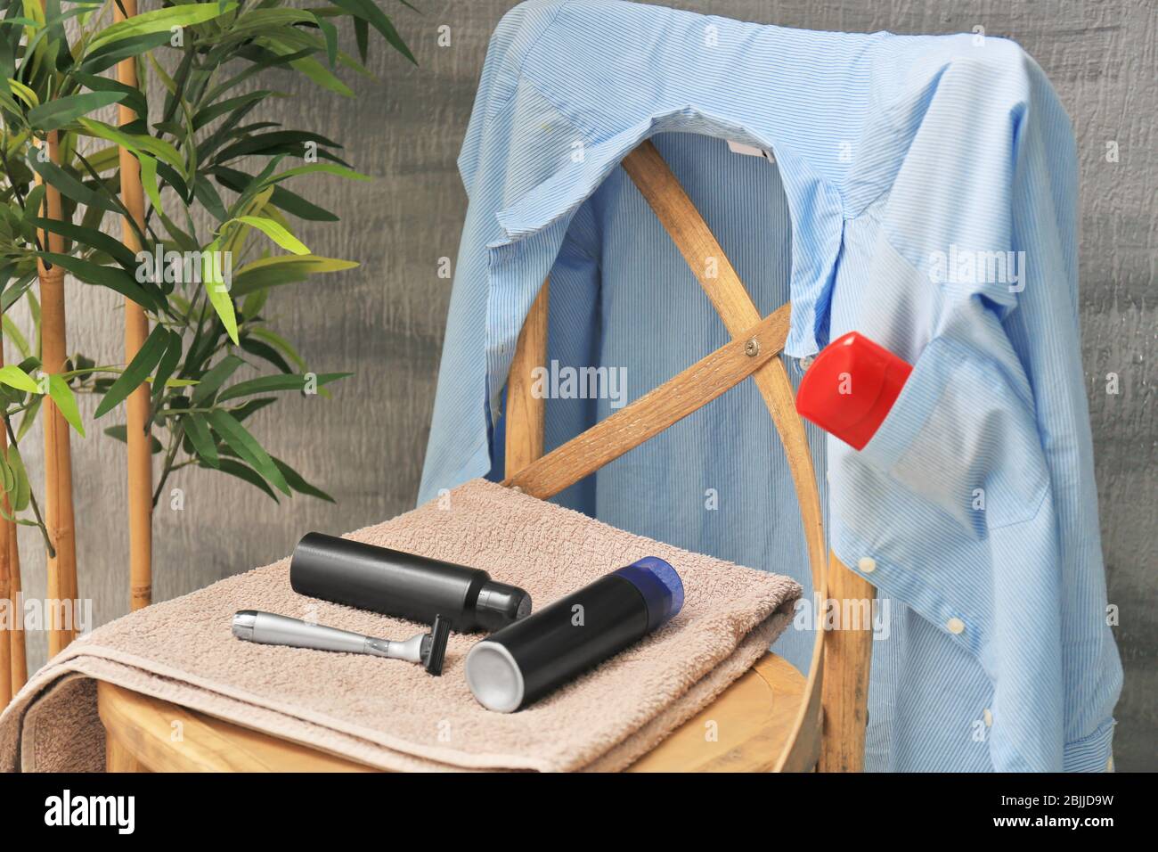 Set of items for male hygiene on chair Stock Photo - Alamy