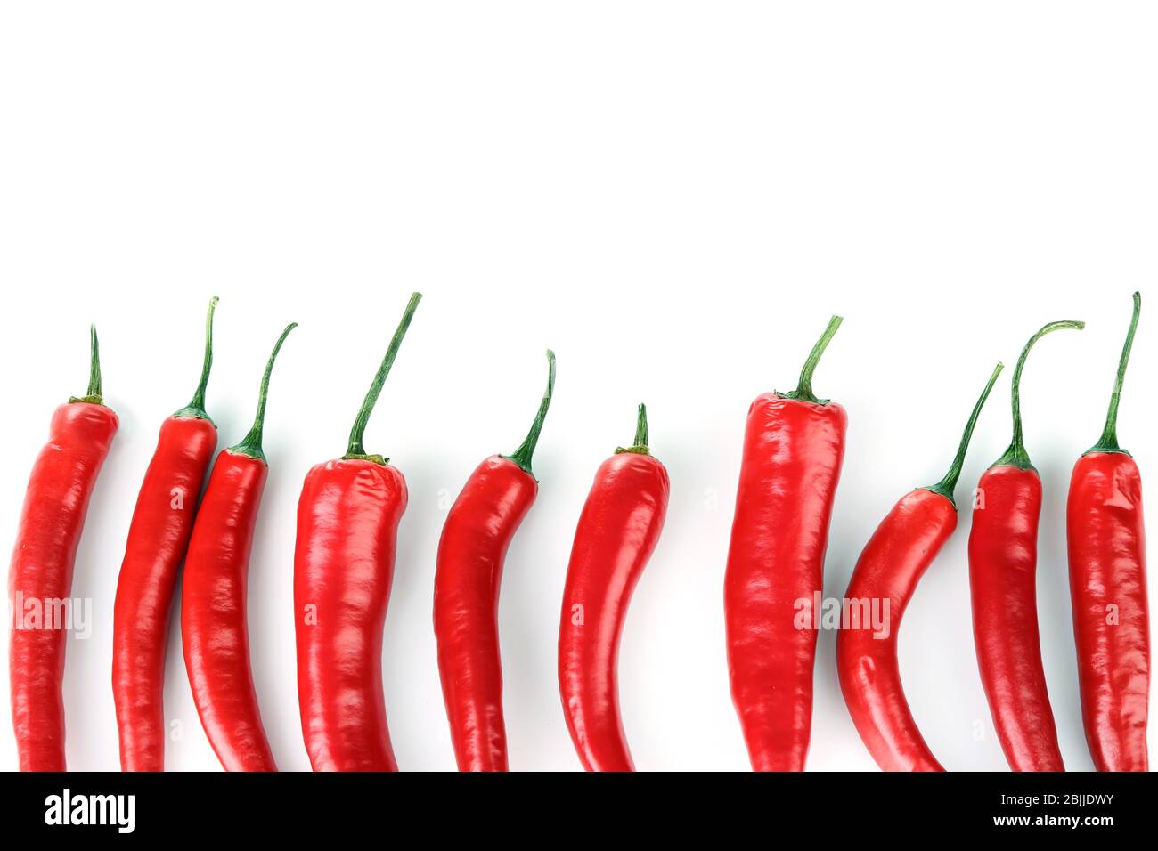 Chili peppers on white background Stock Photo - Alamy