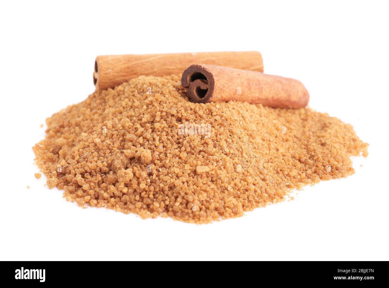 Sweet cinnamon sugar on white background Stock Photo - Alamy