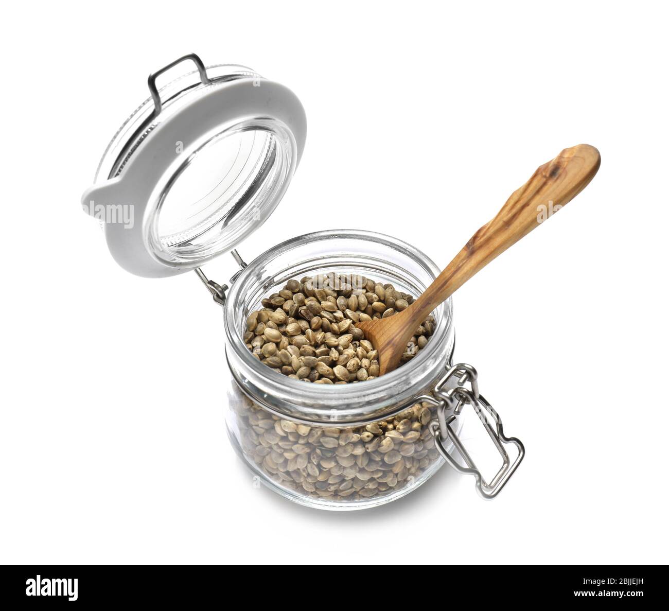 Jar with hemp seeds and spoon on white background Stock Photo - Alamy