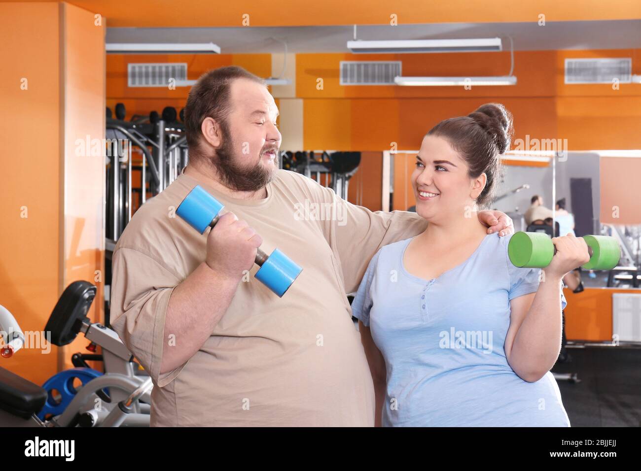Overweight couple in gym Stock Photo - Alamy