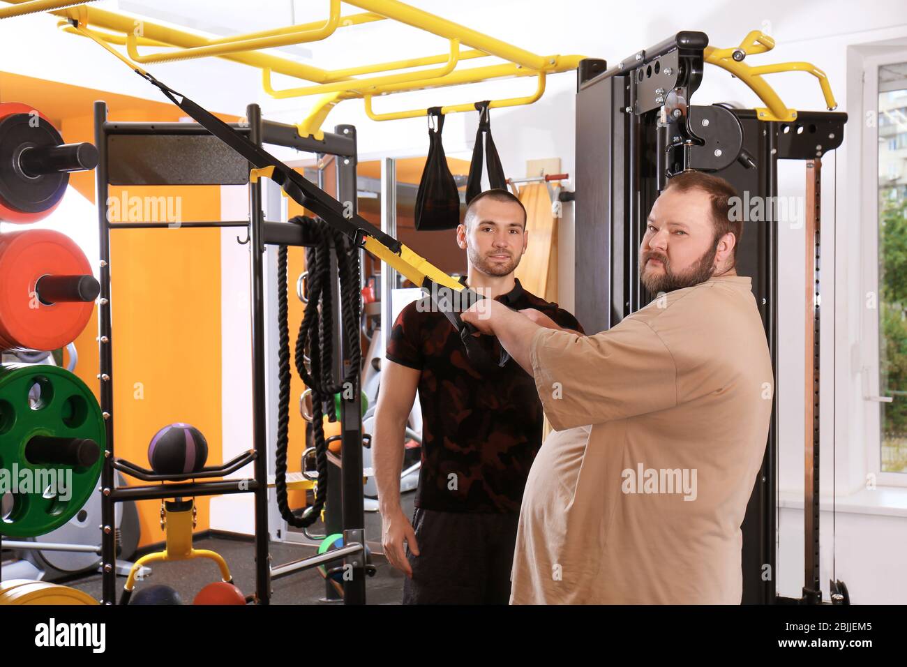 Overweight man trainer in hi-res stock photography and images - Alamy
