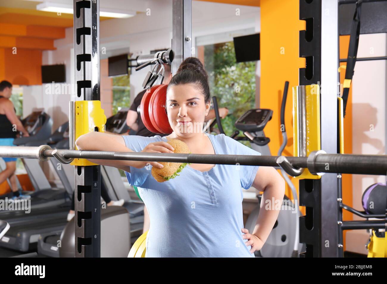 Woman eating club sandwich hi-res stock photography and images - Alamy
