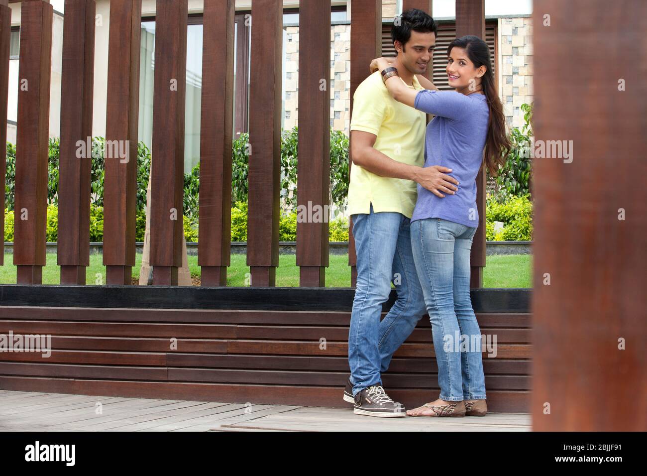 Couple standing together Stock Photo - Alamy
