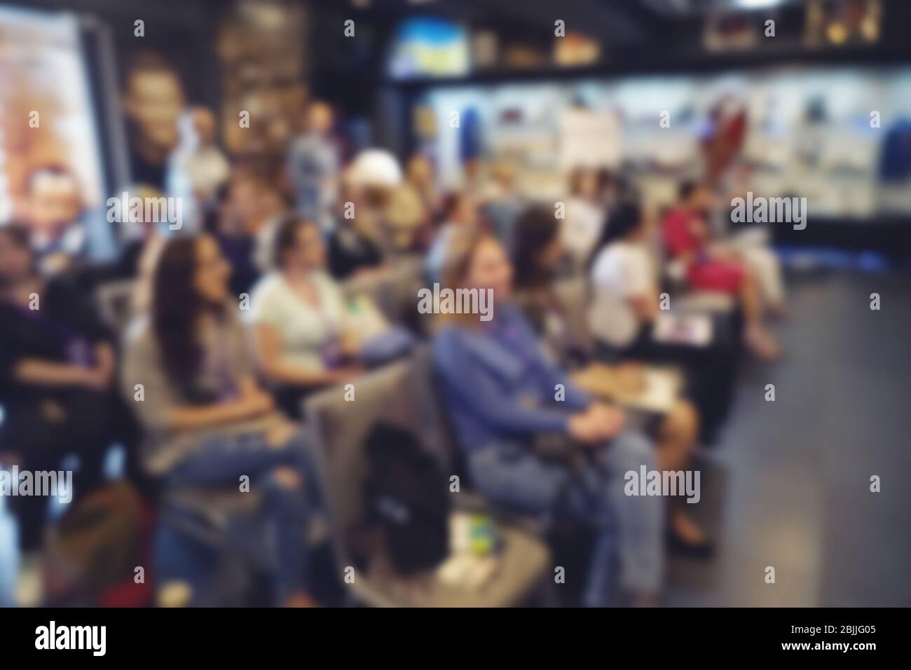 Blurred people sitting in conference room Stock Photo - Alamy
