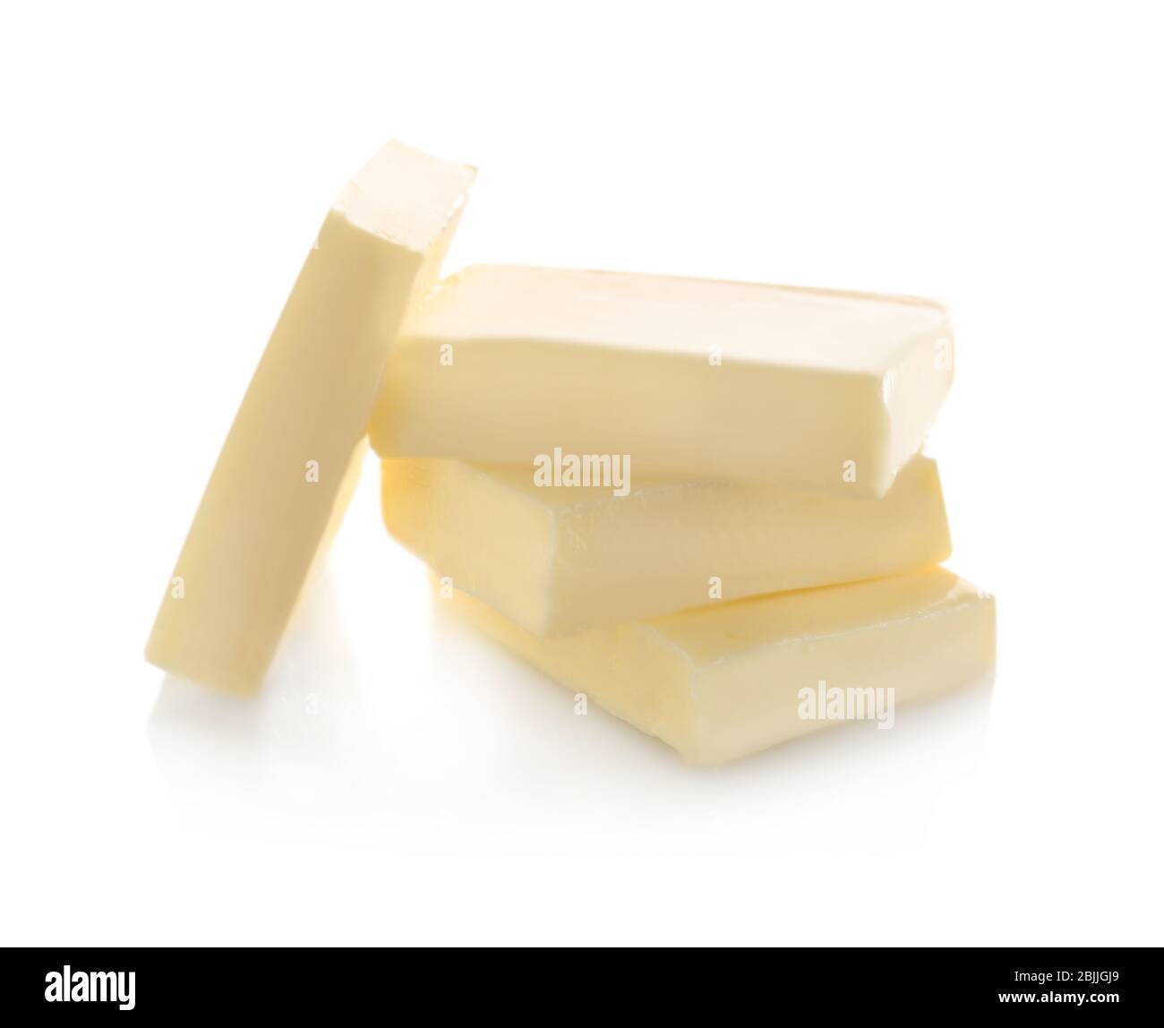 Cut block of butter isolated on white Stock Photo - Alamy