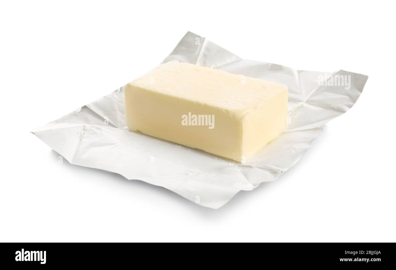 Whole block of butter in open foil packaging isolated on white Stock ...