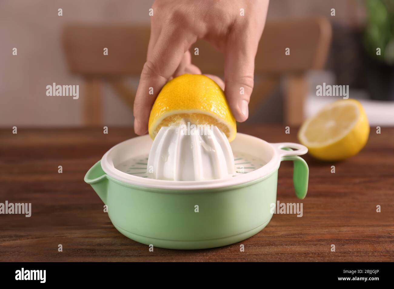 Woman pressing fruit hi-res stock photography and images - Alamy