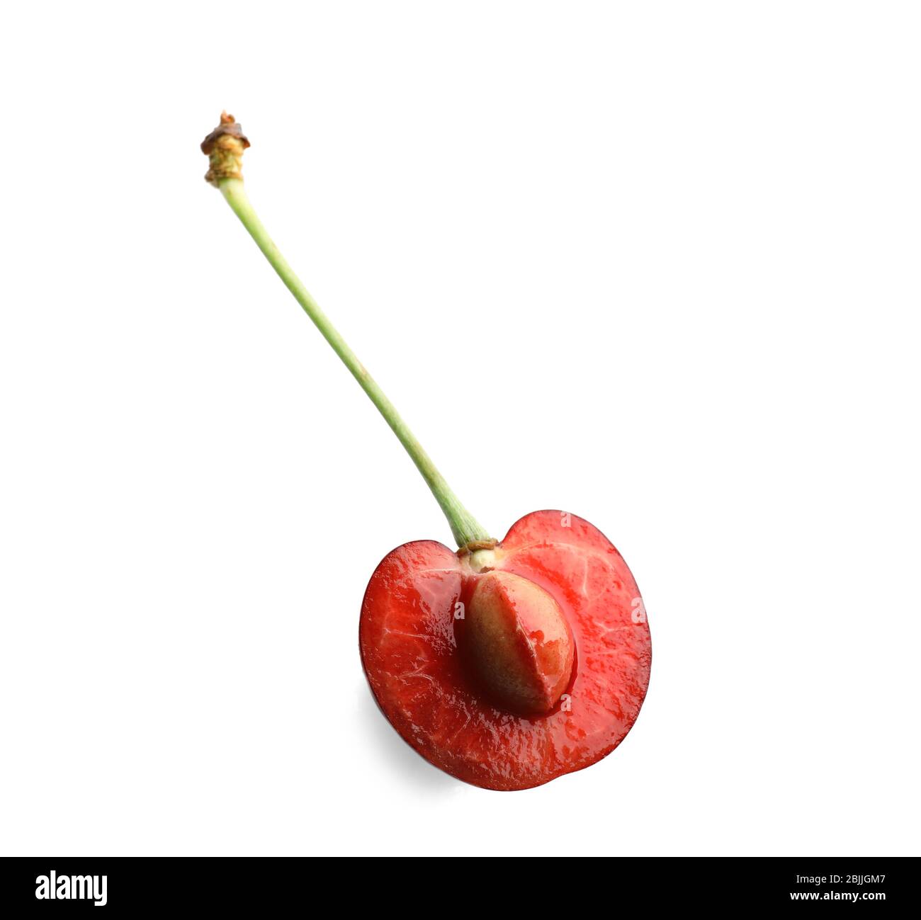 Fresh ripe cherry cut in half on white background Stock Photo - Alamy