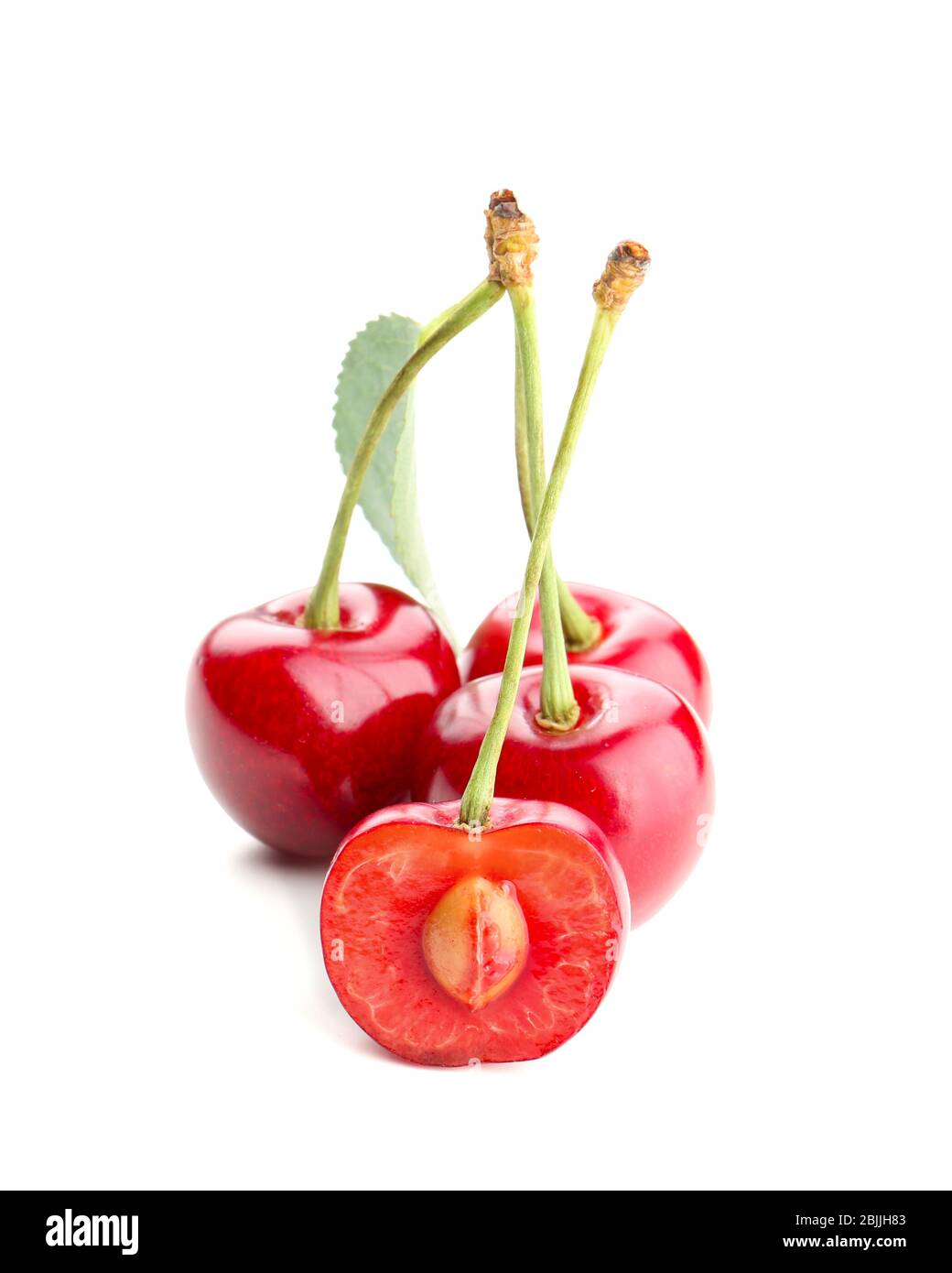 Whole and half cut cherries, isolated on white Stock Photo - Alamy