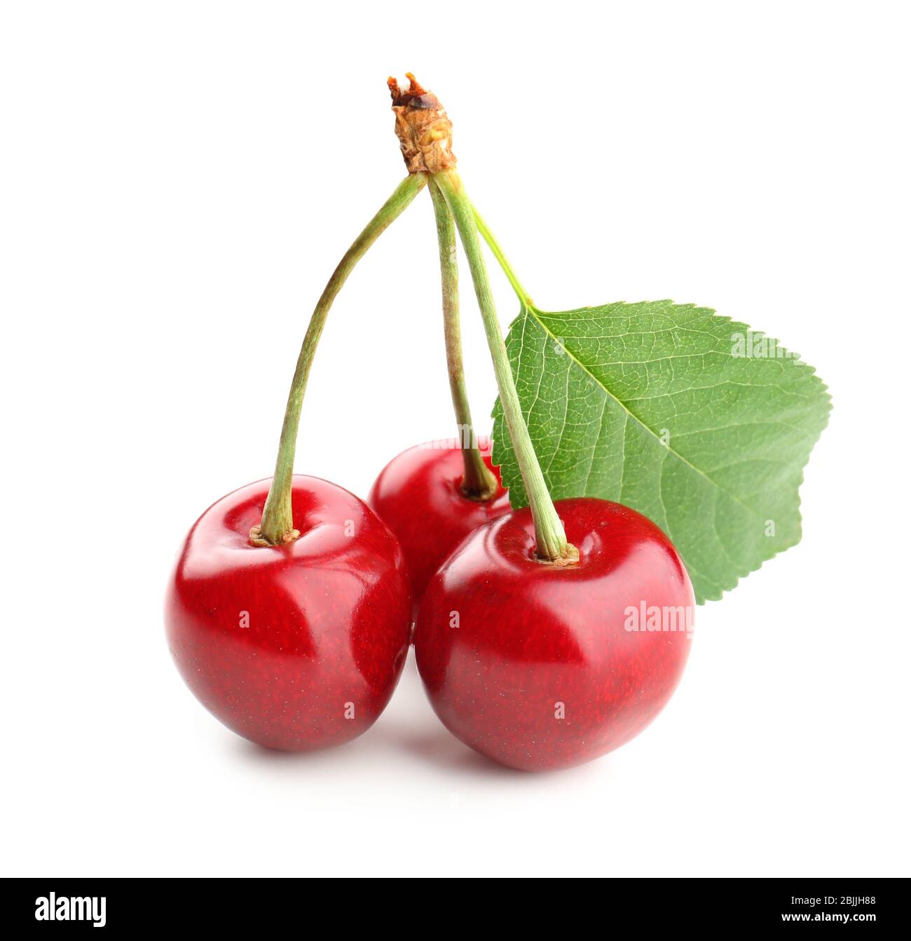 Sweet red cherries, isolated on white Stock Photo - Alamy