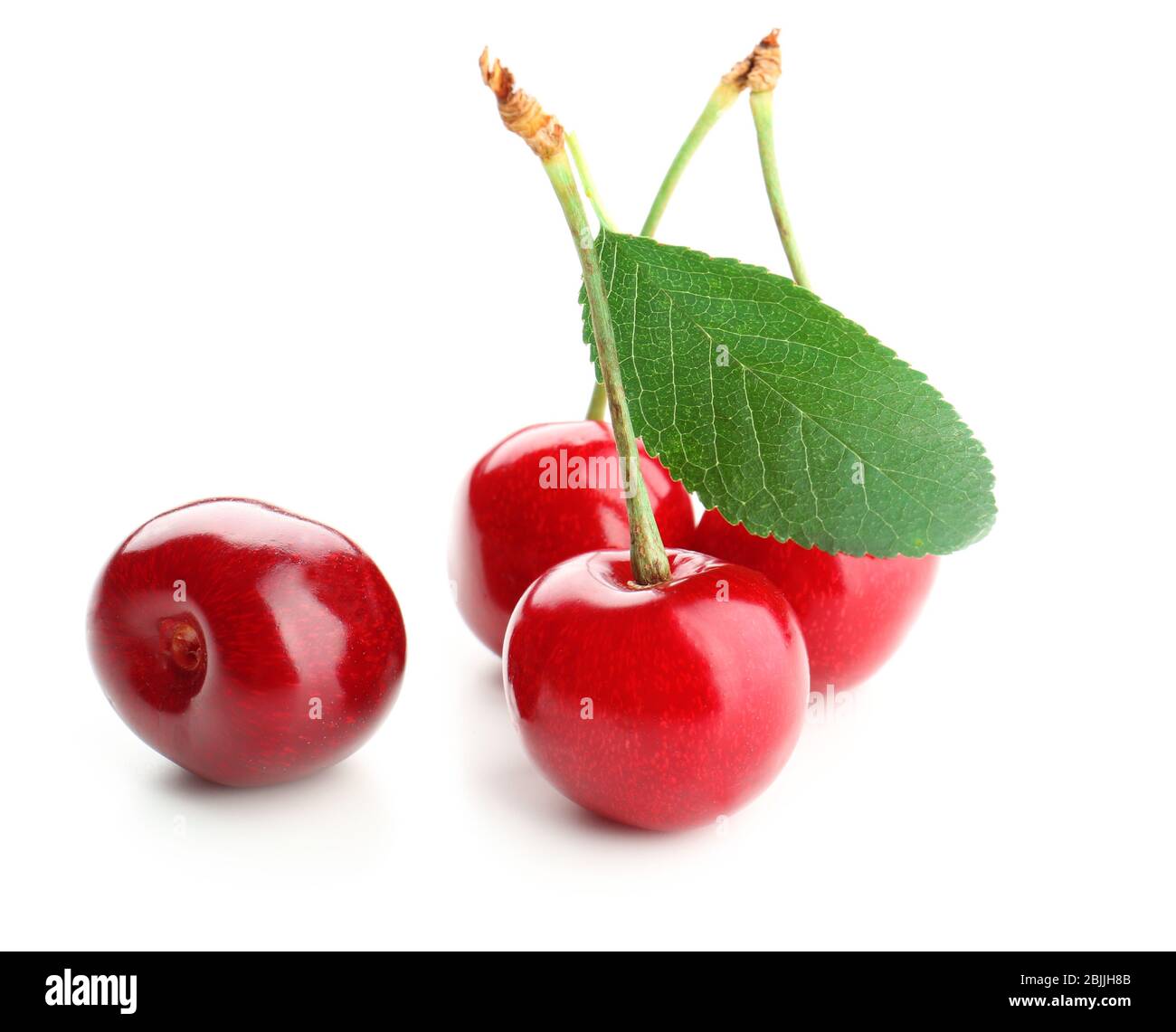 Sweet red cherries, isolated on white Stock Photo - Alamy
