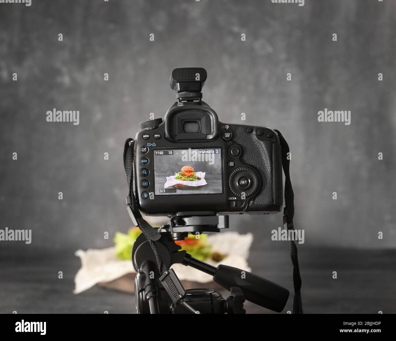 Professional camera on tripod while shooting food Stock Photo - Alamy