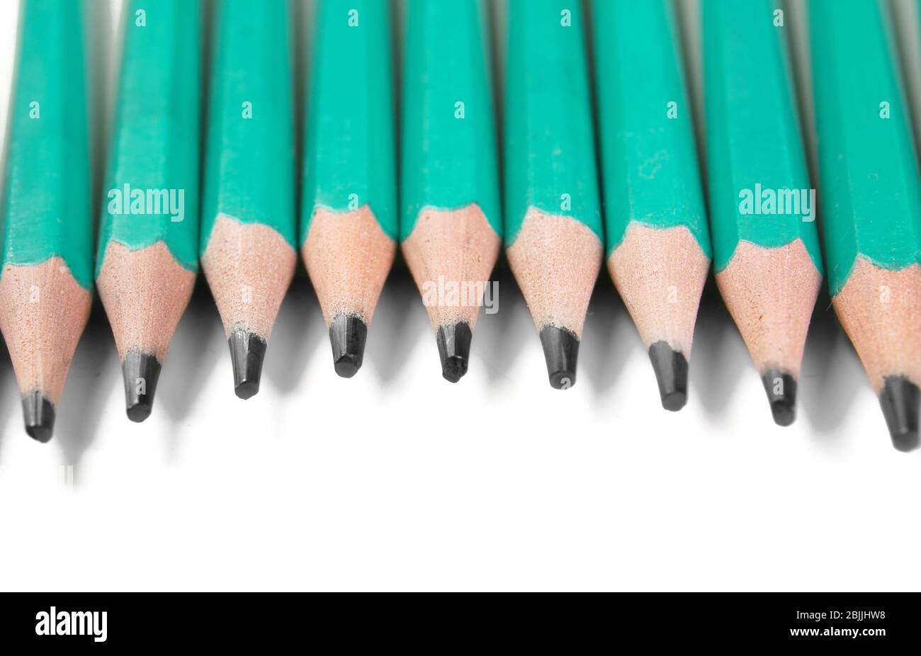 Green pencils on white background Stock Photo - Alamy