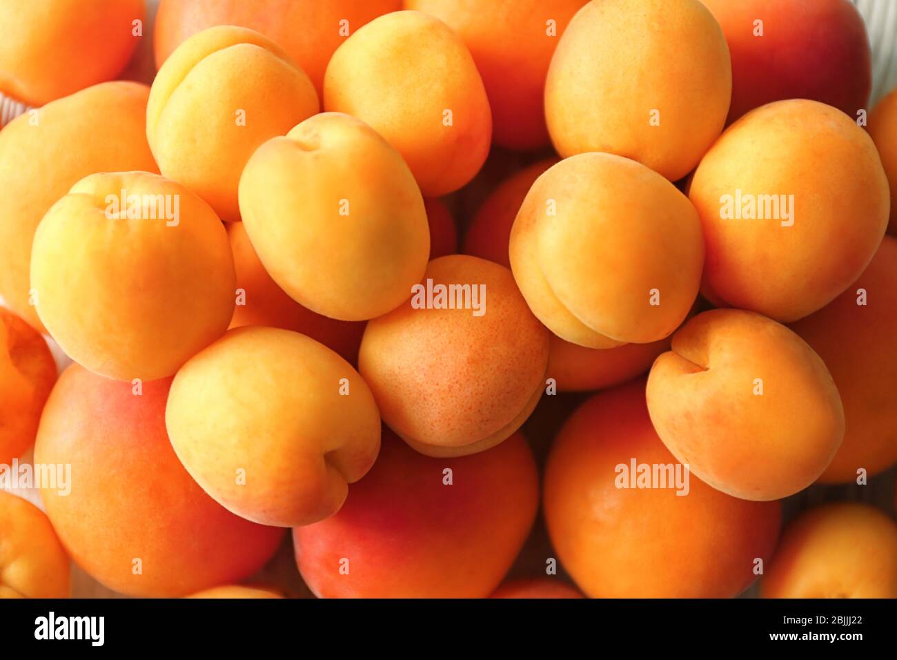 Fresh apricots as background Stock Photo - Alamy