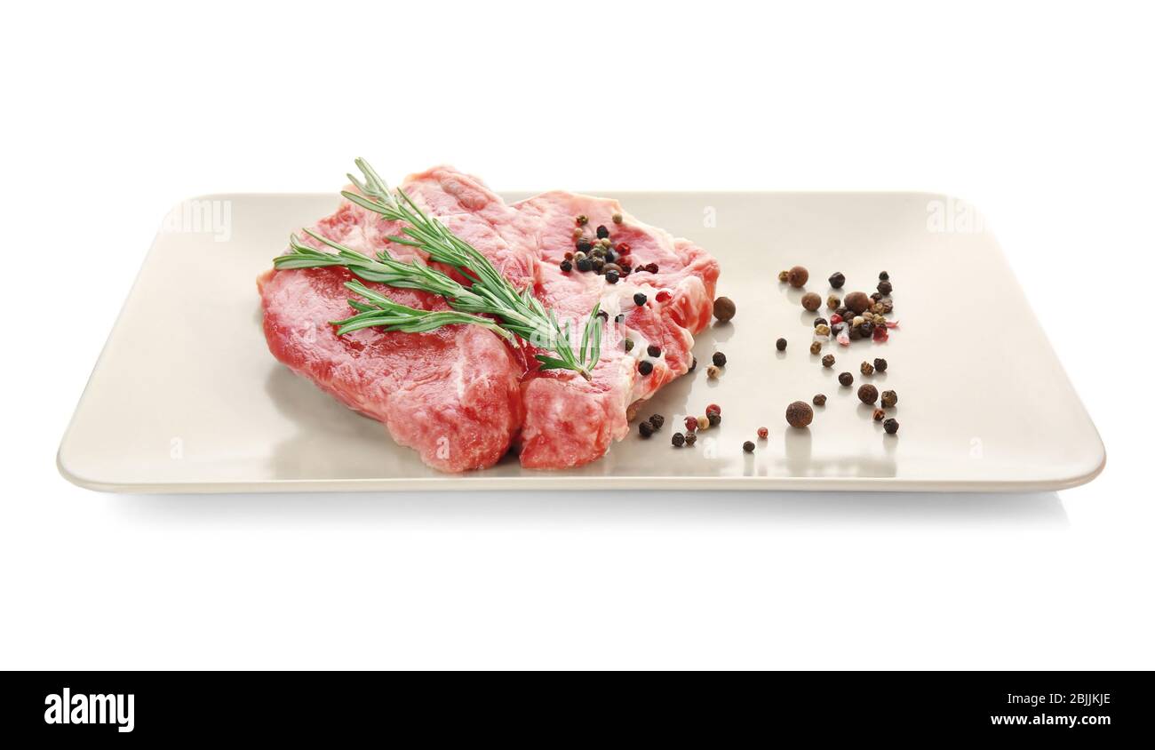 Plate with fresh raw meat, isolated on white Stock Photo - Alamy