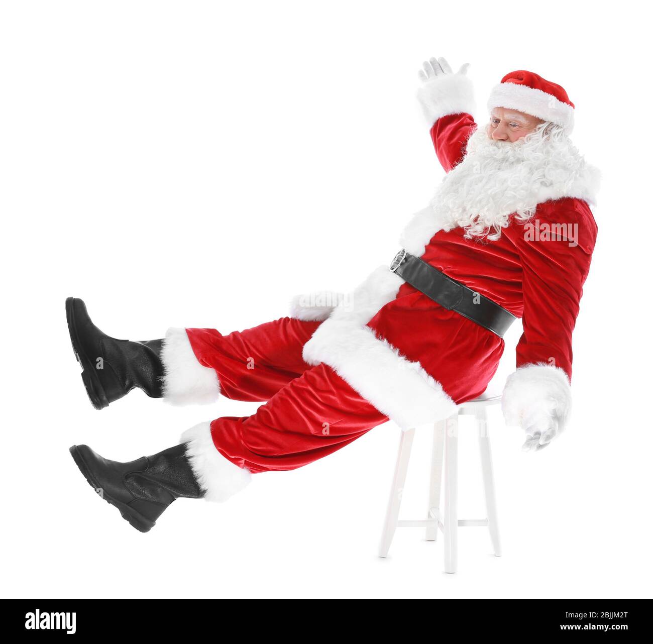 Authentic Santa Claus sitting on chair against white background Stock ...