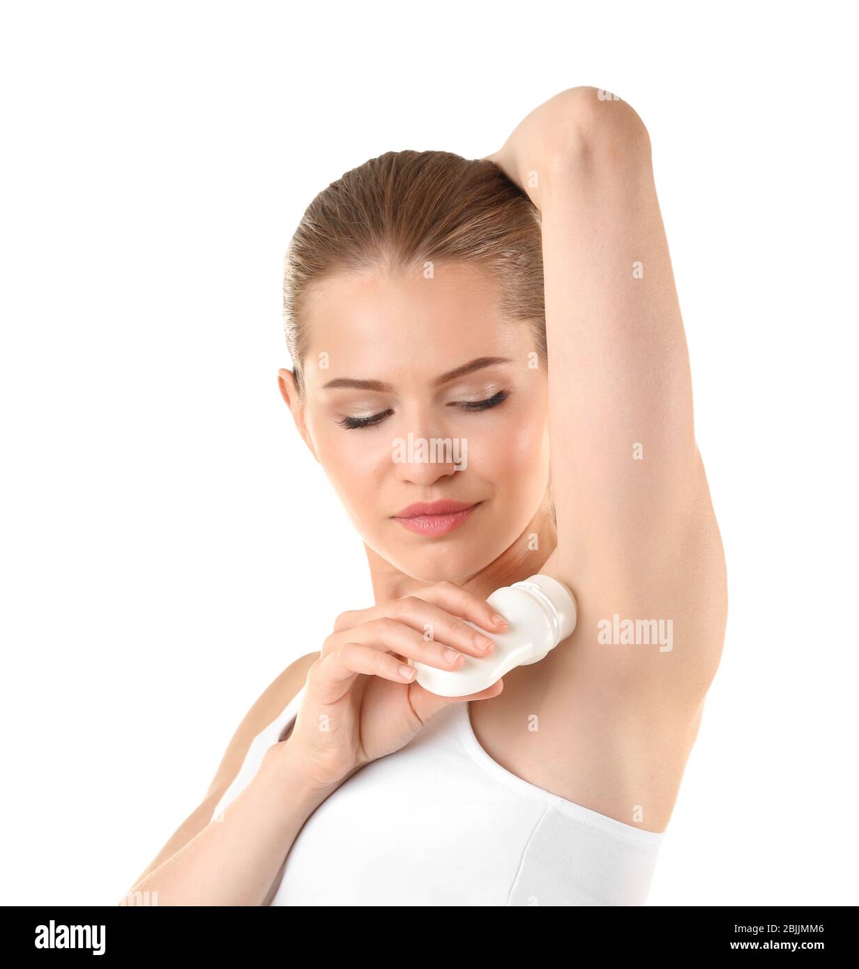 Woman apply deodorant Cut Out Stock Images & Pictures - Alamy