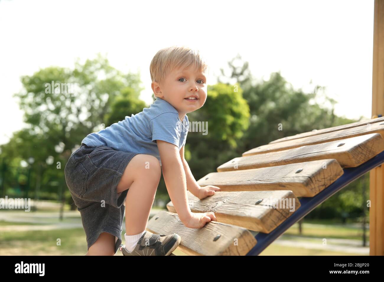 Cute little boy on children's playground Stock Photo - Alamy