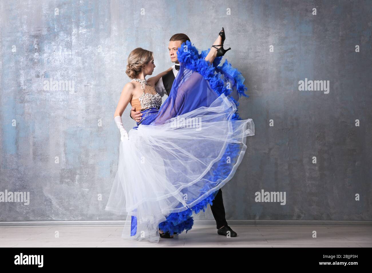 Beautiful young couple in dance studio Stock Photo - Alamy