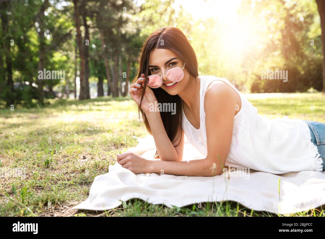 Beautiful young woman sunbathing hi-res stock photography and images ...
