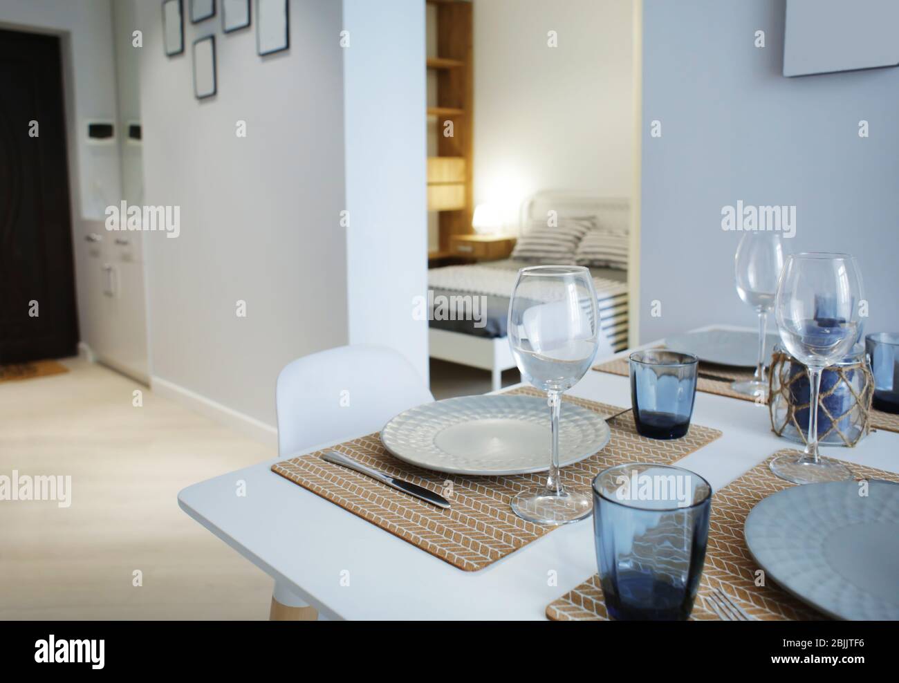 Modern kitchen interior with served table Stock Photo - Alamy