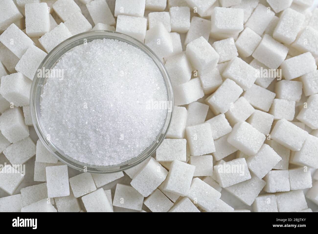 Granulated sugar in jar on sugar cubes Stock Photo - Alamy