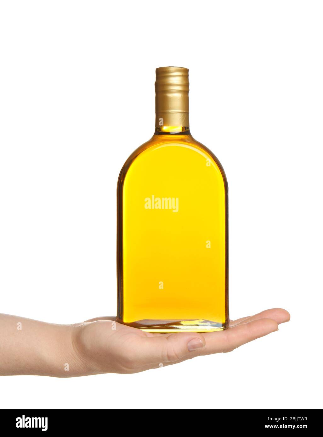 Female hand holding bottle of cooking oil on white background Stock ...