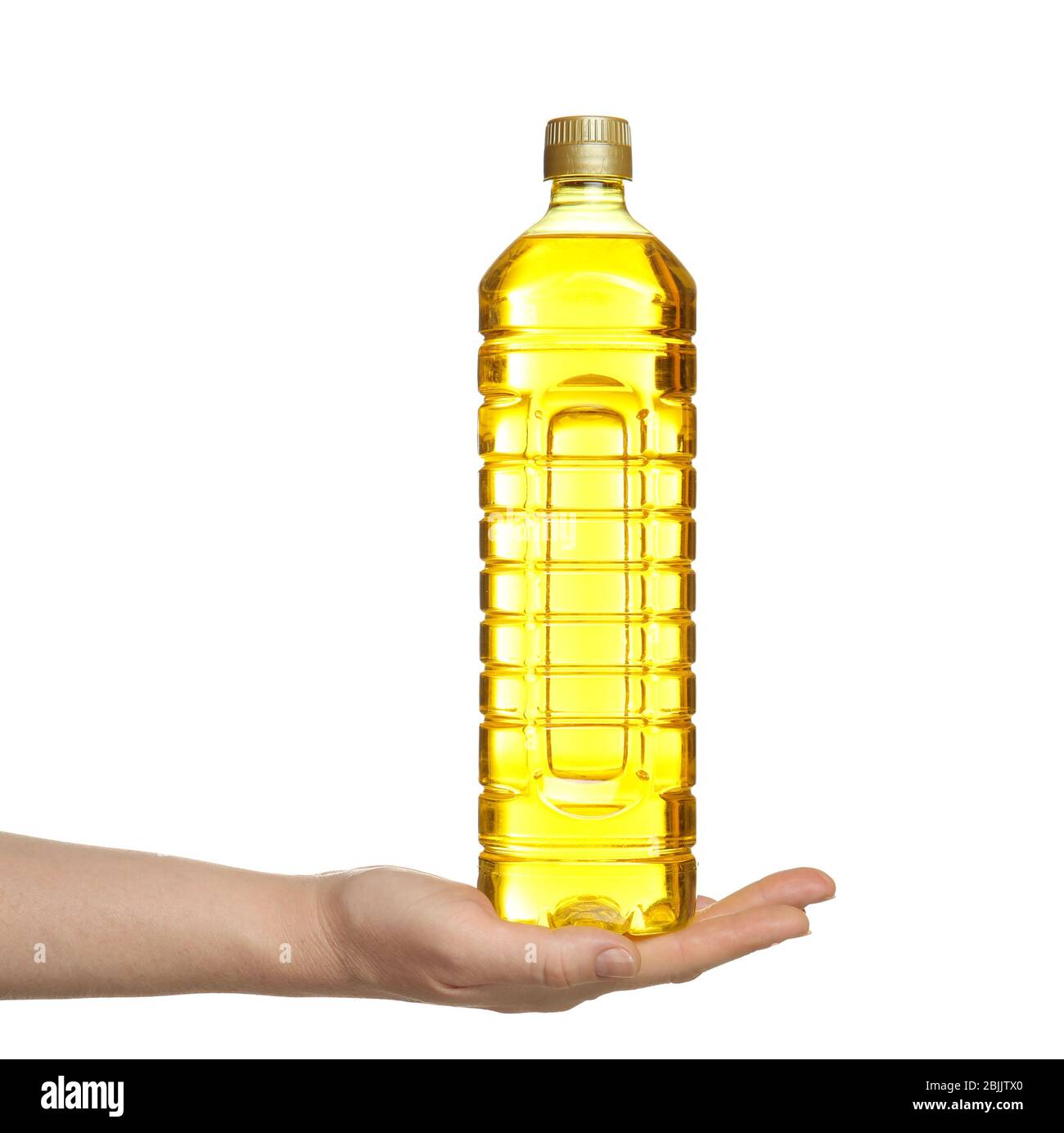 Female hand holding bottle of cooking oil on white background Stock ...