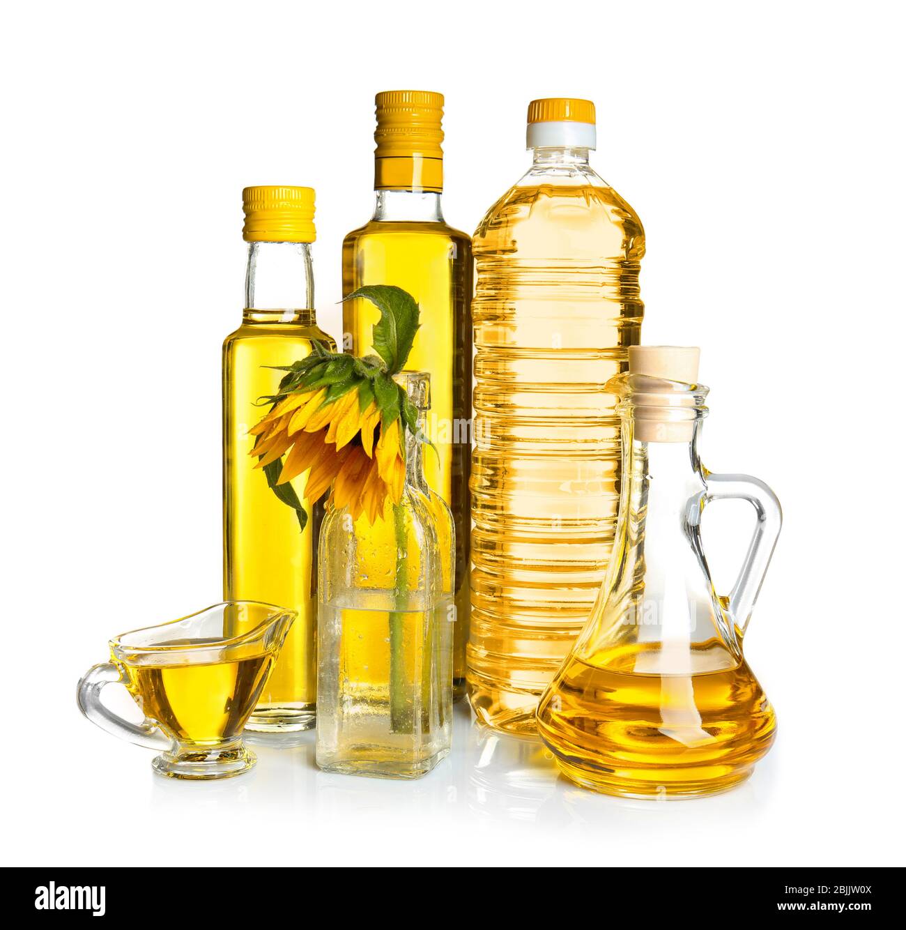 Composition with cooking oil and sunflower on white background Stock ...