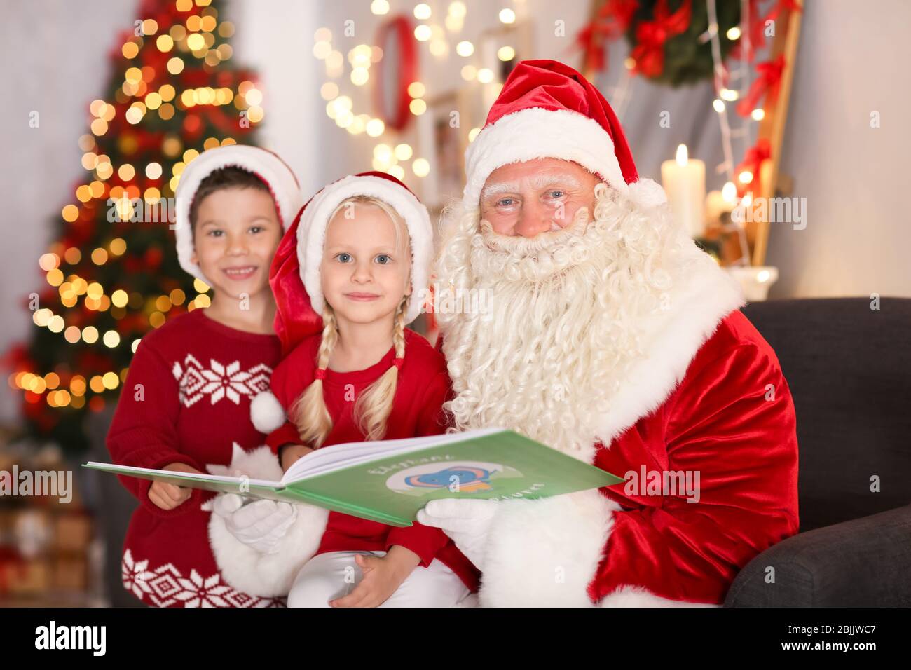 Santa reading book hi-res stock photography and images - Alamy