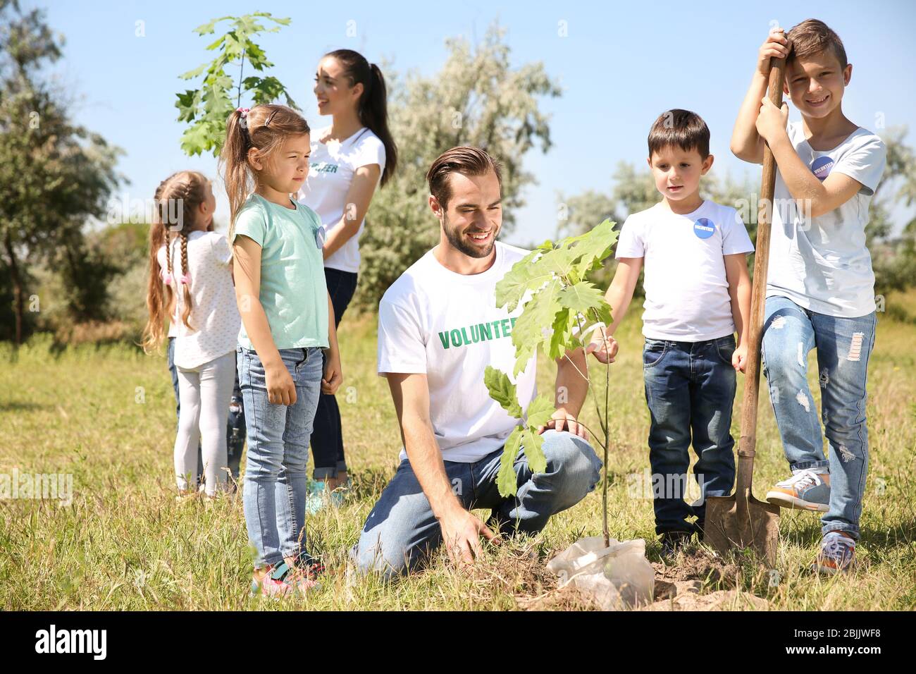 Children planting tree hi-res stock photography and images - Alamy
