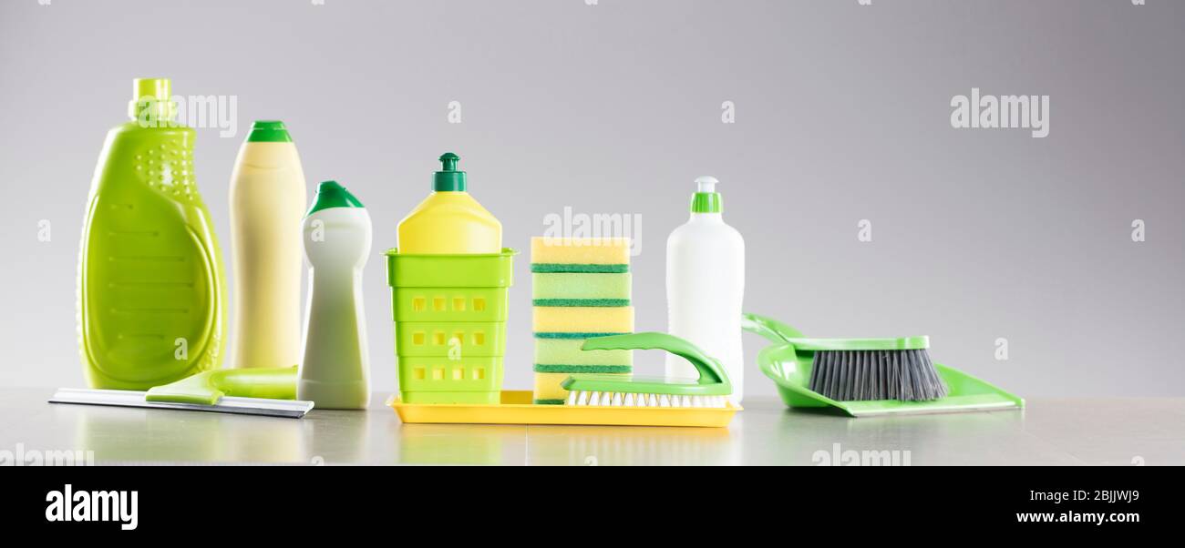 Spring house cleaning. Colorful cleaning kit on white-off background ...