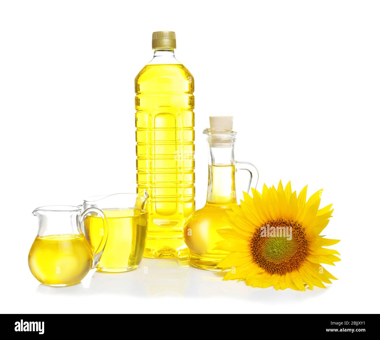 Composition with cooking oil and sunflower on white background Stock ...