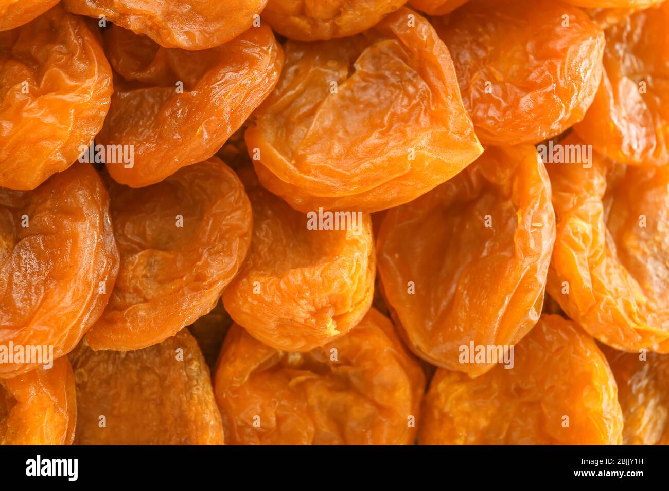 Dried apricots as background Stock Photo - Alamy