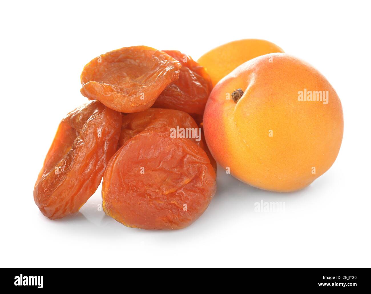 Dried and fresh apricots on white background Stock Photo - Alamy
