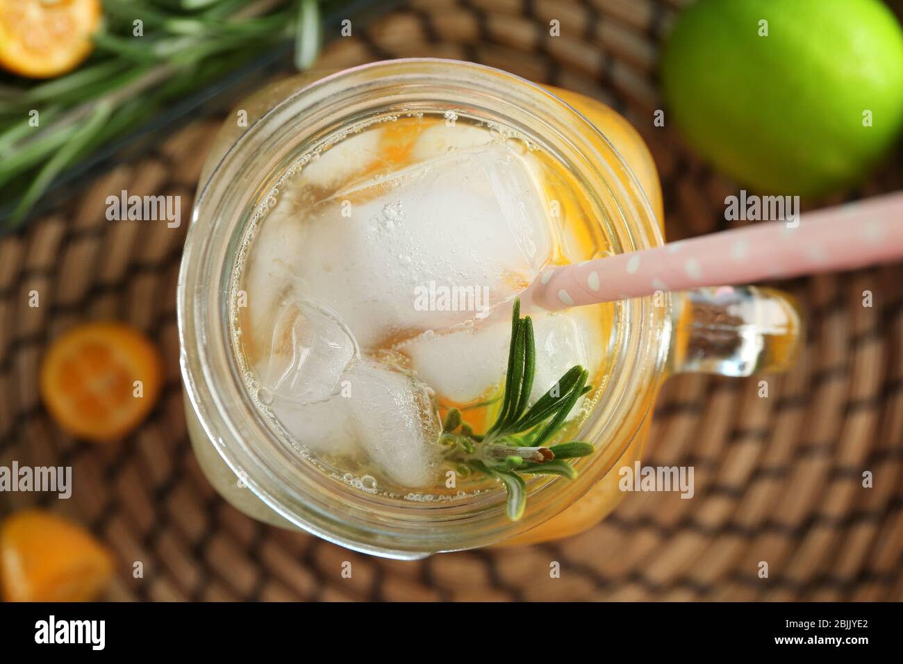 Mason jar with fresh rosemary drink on wicker mat Stock Photo - Alamy