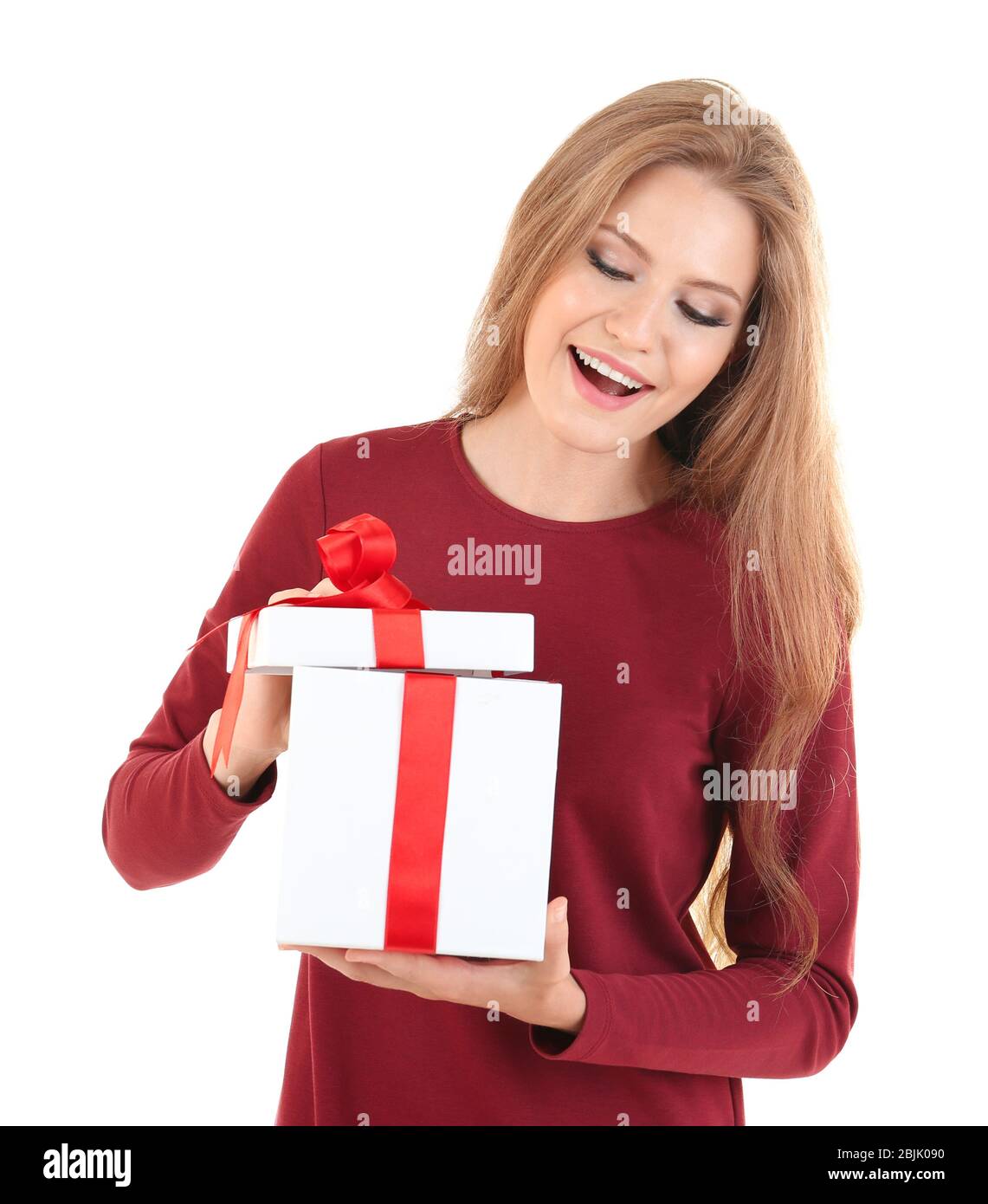 Beautiful lady opening gift box against white background Stock Photo ...