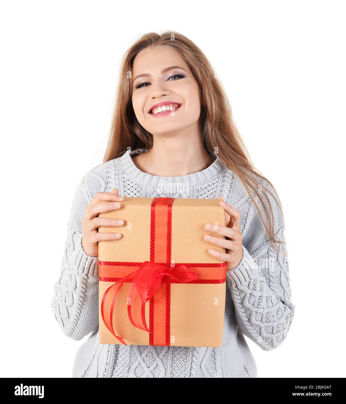 Pretty young lady holding gift box on white background Stock Photo - Alamy