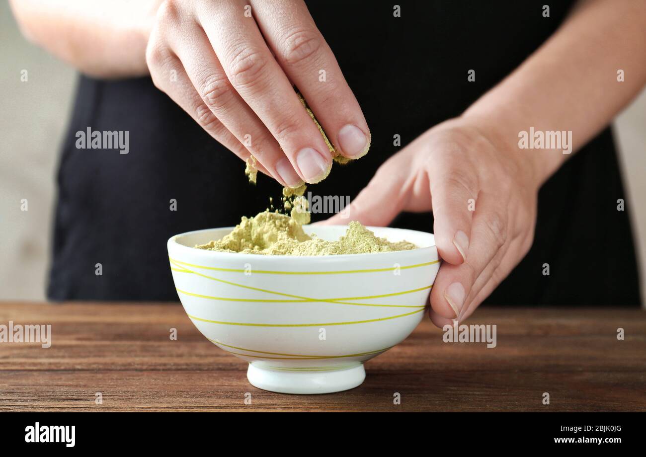 Sprinkling powder hands hi-res stock photography and images - Alamy